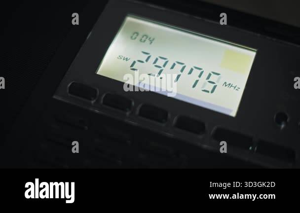 Close-up of a modern digital radio display scanning down SW frequencies ...