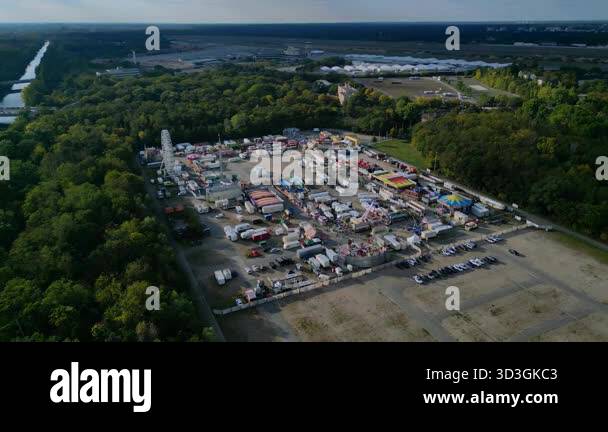 Berlin funfair showing a Ferris wheel, amusement rides, and various ...