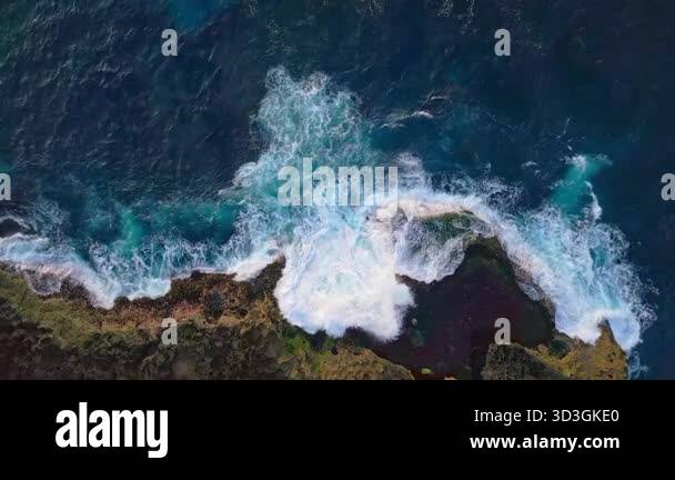 Top View Sea Waves Breaking in Reefs of Coast Mountain Cliff. Aerial ...