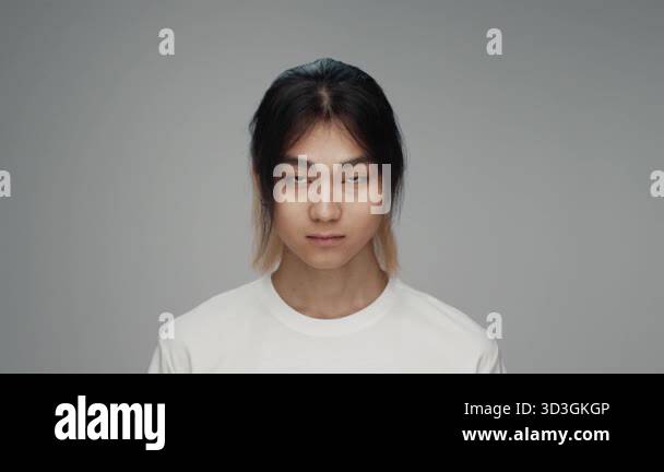 Portrait of Young Korean Man Looking at Camera in Colour Studio Shot ...