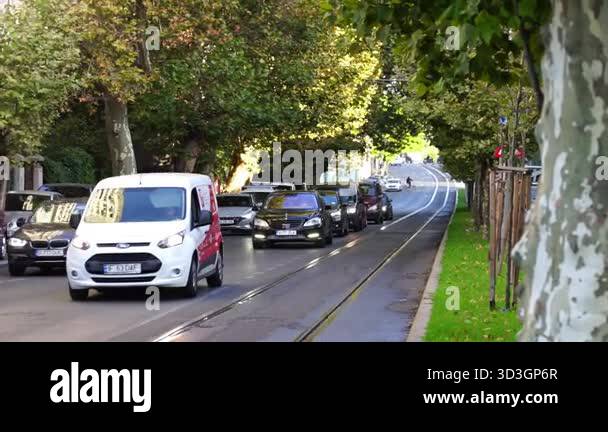Busy city street with heavy car traffic, rush hour congestion and ...