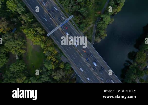 Aerial view showing busy highway traffic crossing a bridge over a river ...