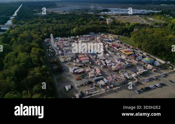 Aerial view of an outdoor forest fairground, funfair, carnival with ...