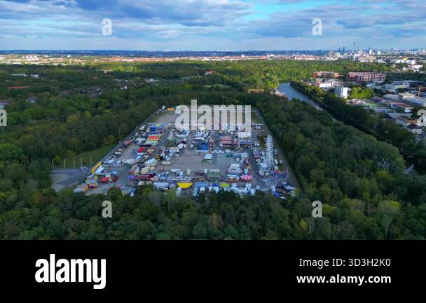 Aerial view of an outdoor forest fairground, funfair, carnival with ...