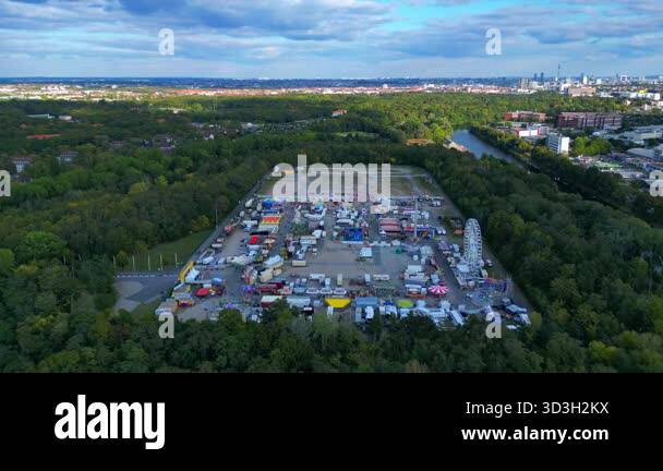 Aerial view of an outdoor forest fairground, funfair, carnival with ...