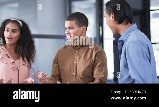 Happy diverse colleagues talking, rewarding best workers and shaking ...