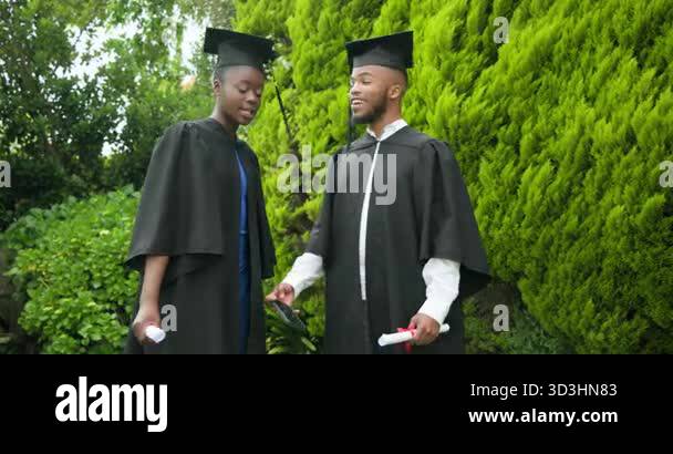 Graduating students taking selfie with diploma, celebrating outdoors ...