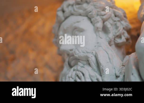 Beautiful white statues shaped like humans and animals are displayed in ...