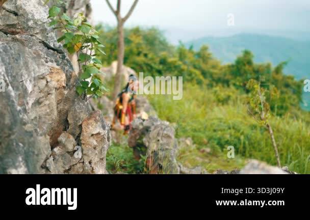 a female warrior in a golden dress and crown walks in a forest with a ...