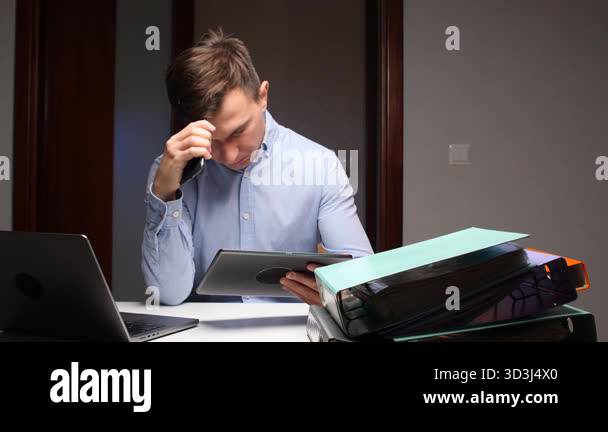 Overwhelmed businessman feeling stressed and tired from multitasking ...