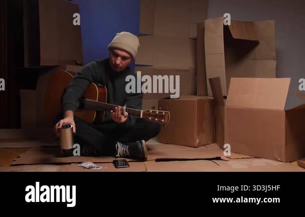 Homeless man busking playing Stock Videos & Footage - HD and 4K Video ...