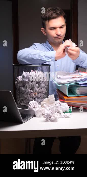 vertical video Young man feeling burnout and stress, discarding ...