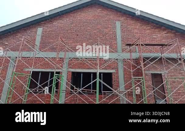 temporary raised platform or scaffold on which workers stand to do ...