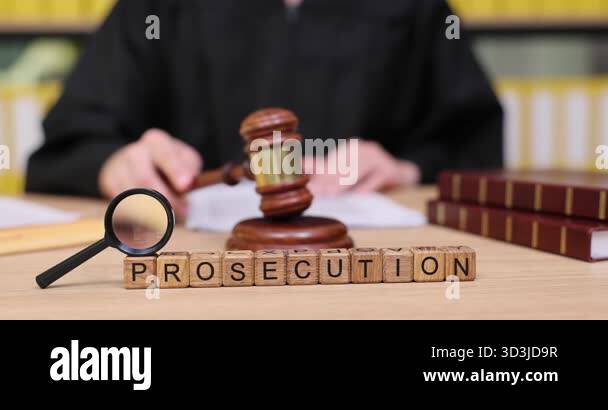 In a courtroom setting, a judge examines evidence while a gavel strikes ...
