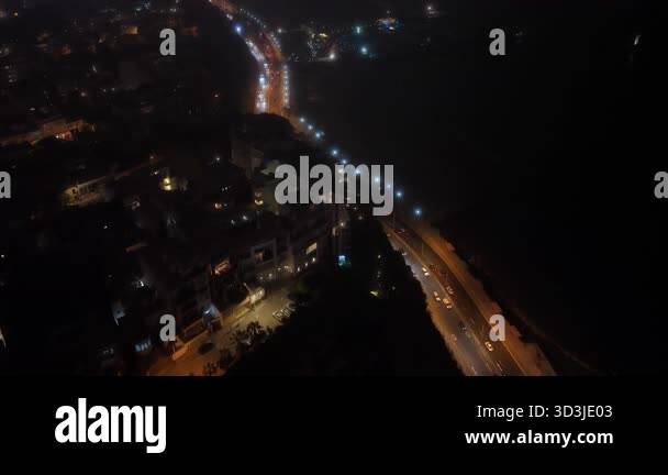 Night aerial view of Lima, Peru, showing the Circuito de Playas highway ...