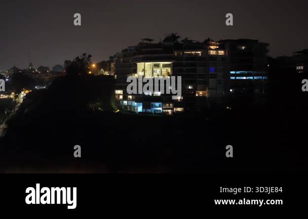 Nighttime aerial view of luxurious houses of La Quebrada and modern ...