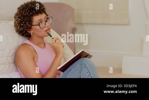 Flipping notebook pages, woman in pink top and jeans scribbling journal ...
