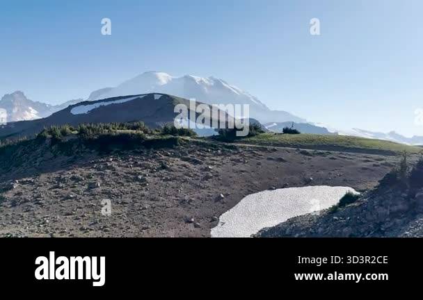 A camera pan showing a place with few vegetation and glaciers in Mount ...
