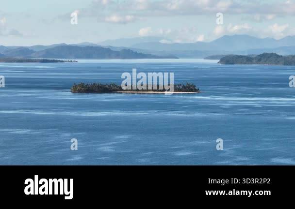 White sand beach in tropical island with palm trees. Blue sea and blue ...