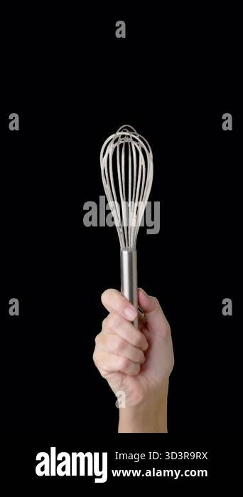 Female Hand Waving A Wire Cooking Whisk In The Air with Alpha Channel ...