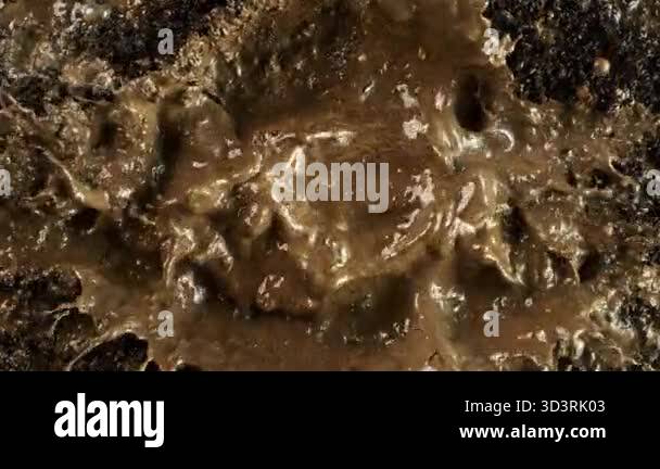 Super Slow Motion Shot of Splashing Mud Background at 1000fps. Filmed ...