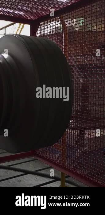 Large industrial machine part rotates slowly, showcasing its complex ...