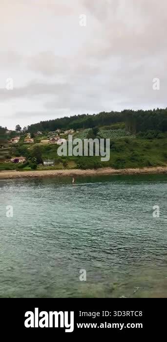 VILLAVICIOSA, SPAIN - AUGUST 18, 2025: Rodiles Beach under cloudy ...