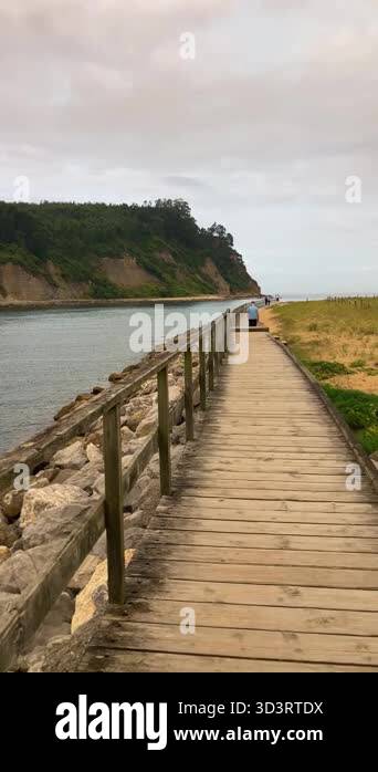 VILLAVICIOSA, SPAIN - AUGUST 18, 2025: Rodiles Beach under cloudy ...
