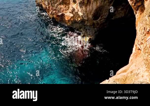 Aerial view of turquoise Mediterranean sea along rocky coast of ...