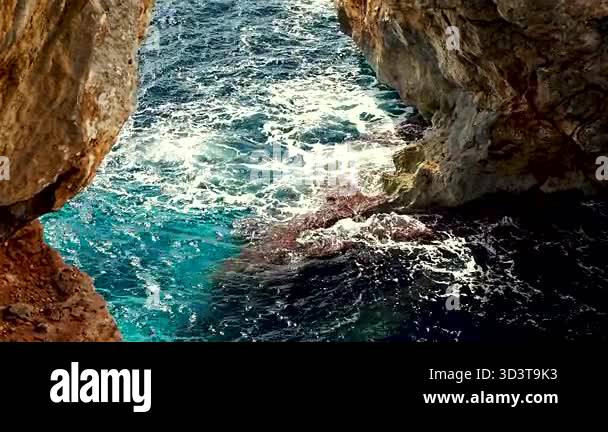 Natural stone arch over turquoise sea at Es Cal Blanc, Mallorca ...