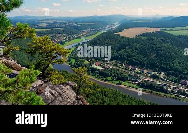 Stunning view from cliff of village landscape, spacious green meadows ...