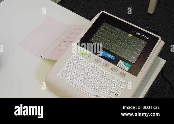 DRESDEN, GERMANY - 14. May 2025: CARDIO M-PRO ECG device printing results on special paper ...