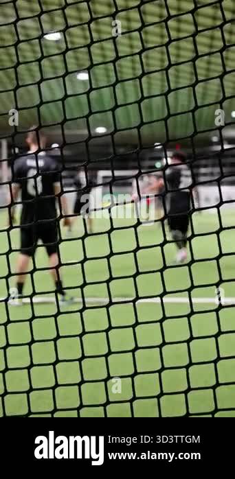 A men play football in the gym on an indoor football field.. Incredible ...