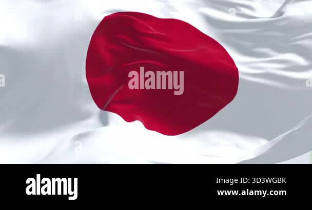 Close-up of Japan national flag waving in the wind. Red disc on a white ...