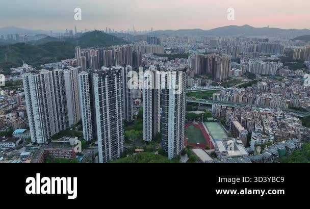 Wide aerial view of dense urban sprawl with high-rise buildings and ...
