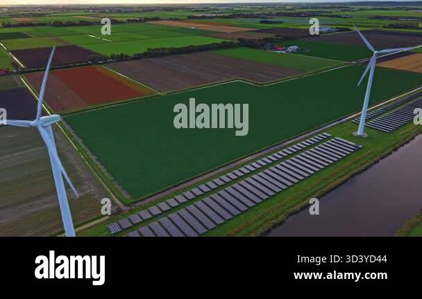 Breathtaking landscape featuring towering wind turbines and solar ...