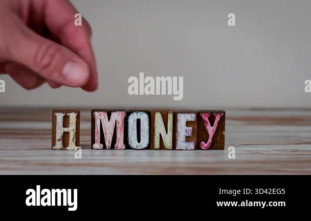 Money Turns Into Honey Concept With Wooden Letter Blocks And Hand Stock ...