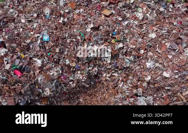 Mixed fragments of metal plastic rubber and wood cover ground like ...