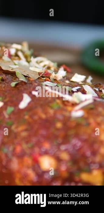 Chef slicing freshly grilled juicy beef steak meat with a knife on a ...