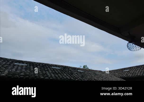 Time-lapse photography of the patio view of tiled roof buildings in ...