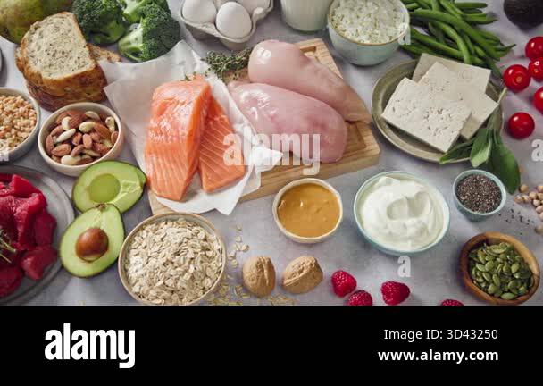 flat lay composition of various fresh protein diet products on grey ...