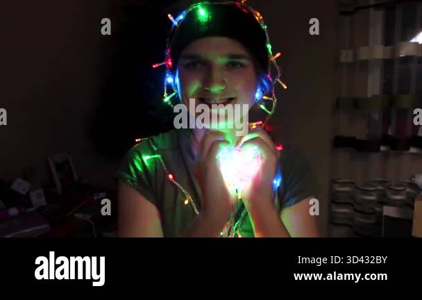 Defocus young woman celebrating Christmas. Young person having fun on ...