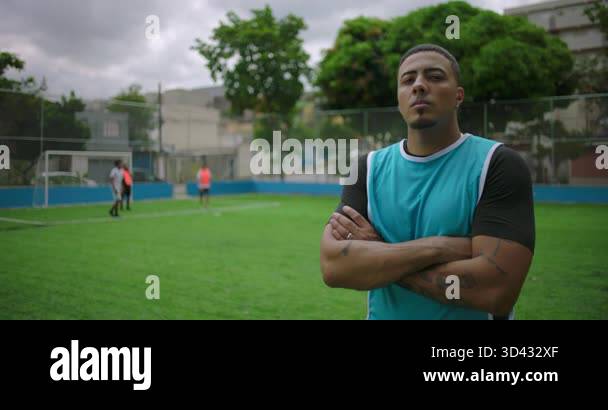 Latin Hispanic man of African descent standing on soccer field with ...