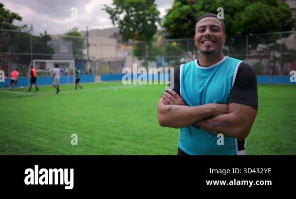 Latin Hispanic man of African descent smiling confidently with arms ...