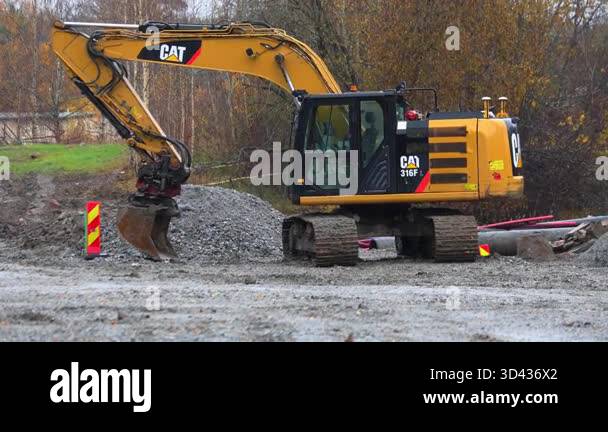 Construction workers installing a new escalator at a building site ...