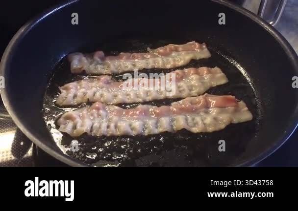 Cook crispy bacon Stock Videos & Footage - HD and 4K Video Clips - Alamy