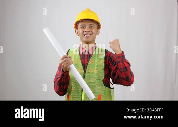 construction workers holding blueprints enthusiastically completing the ...