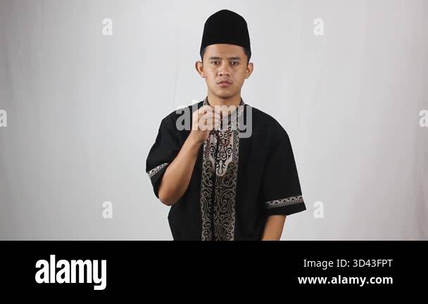 Asian Muslim man reciting dhikr using wooden prayer beads Stock Video ...