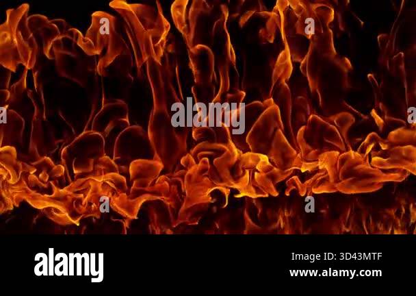 Super slow motion of fire flames isolated on black background. Filmed ...