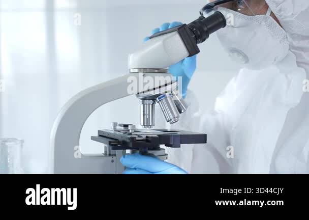 Medical virologist in a hazmat suit, mask, and gloves, diligently ...